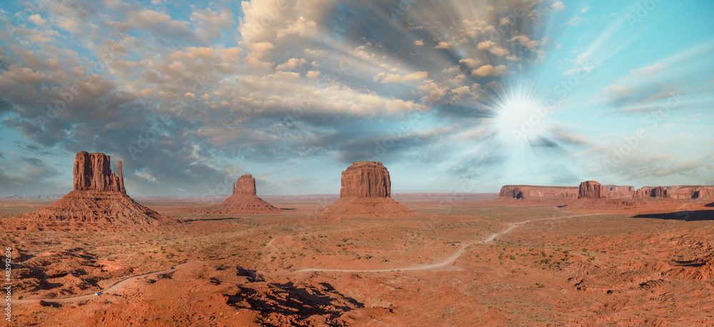 Sunset sky with streaks of blue color over Monument Valley, a region of ...