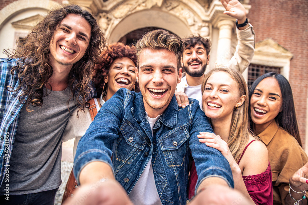 Multicultural best friends having fun taking group selfie portrait ...