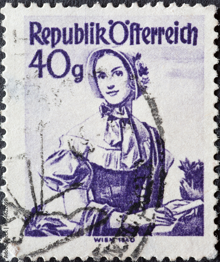 Austria - circa 1948: a postage stamp from Austria, showing a woman in ...