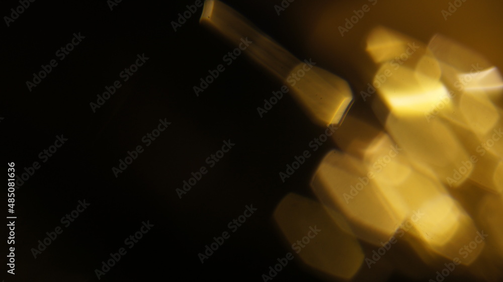 Golden bokeh crystal abstract light rays background, shiny flare ...
