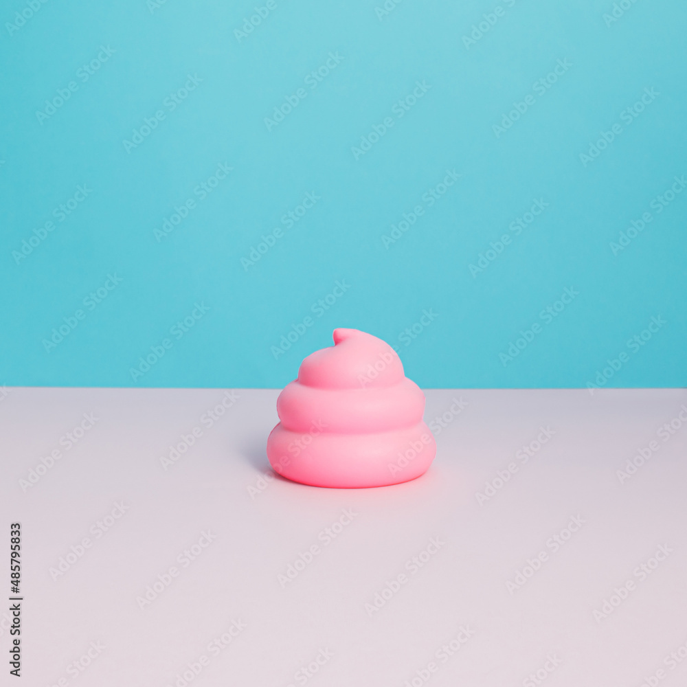 Pink poop emoticon on pastel blue and white background. Funny concept ...