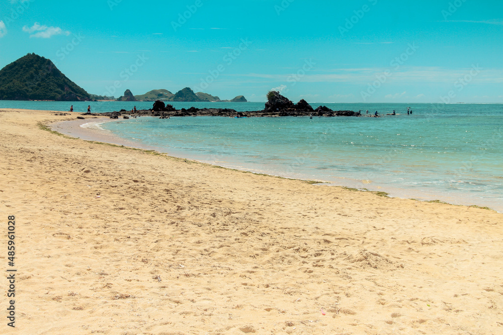The sloping Kute Beach in Lombok, with its calm waters, is the main ...