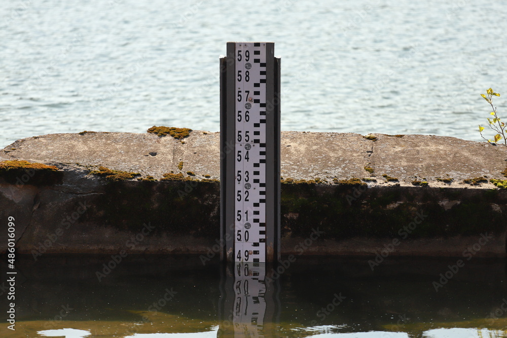 Water depth measurement tool on the lake shore.Observation of the water ...