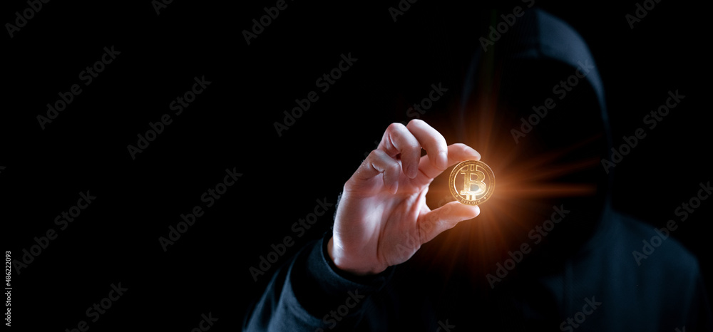 Crypto money bitcoin background. Crypto hacker hand hold golden BTC bit ...