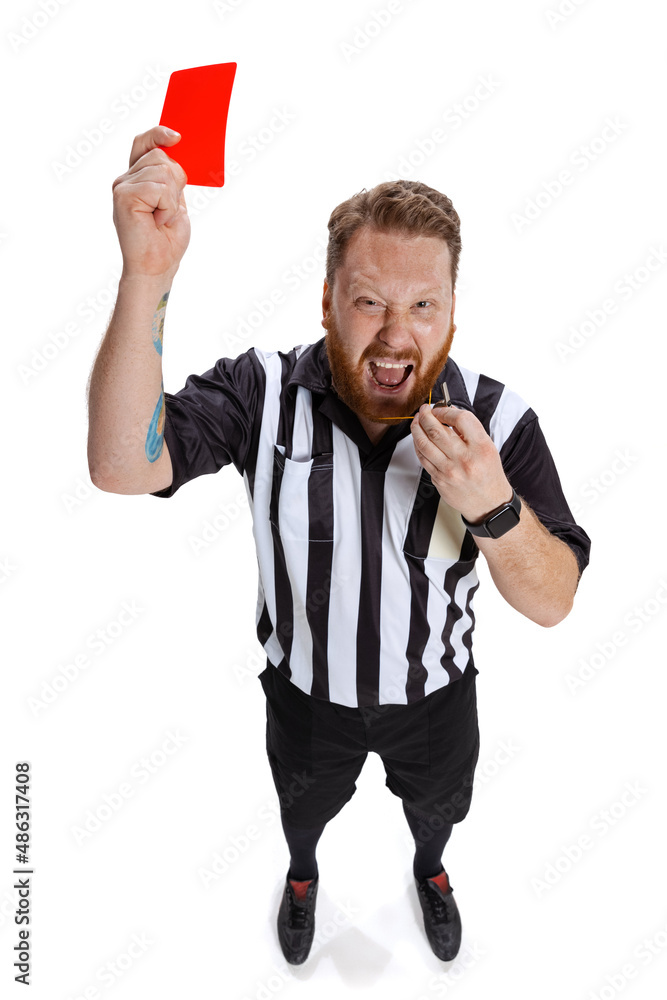 Young excited sport referee wearing field judge uniform showing red ...