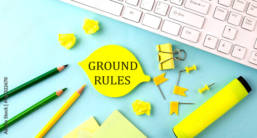 Text sign showing GROUND RULES with office tools and keyboard on the ...