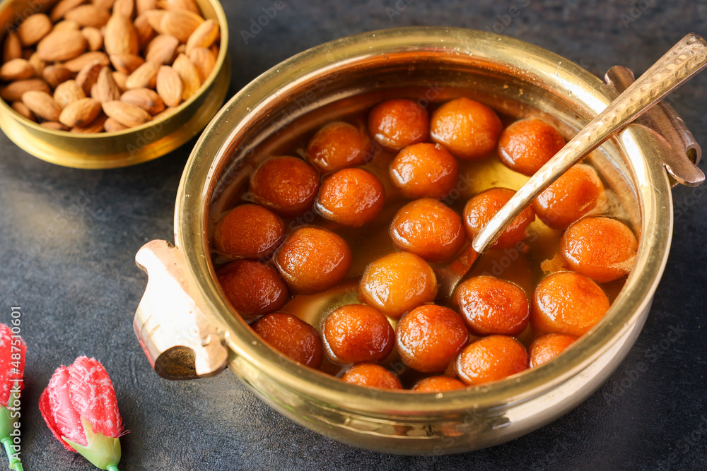 Gulab jamun gulaab jamun sugar syrup golden bowl Indian sweet food ...