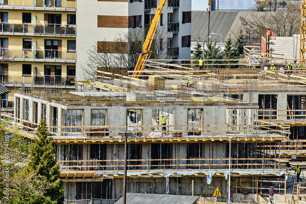 Construction workers install formwork and iron rebars or reinforcing ...
