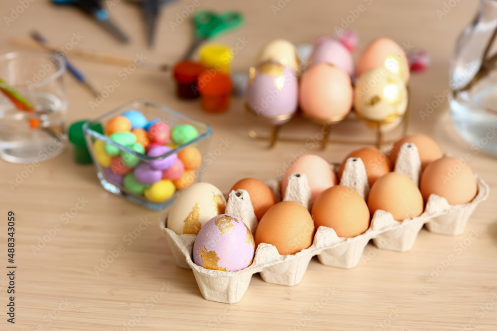 Painted Easter eggs on wooden table Stock Photo | Adobe Stock