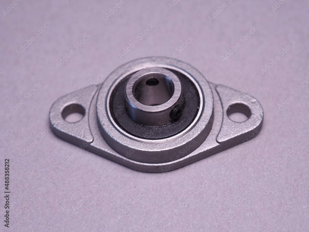 Metal ball bearing in housing. Two bolt flanged housing units. One ball ...
