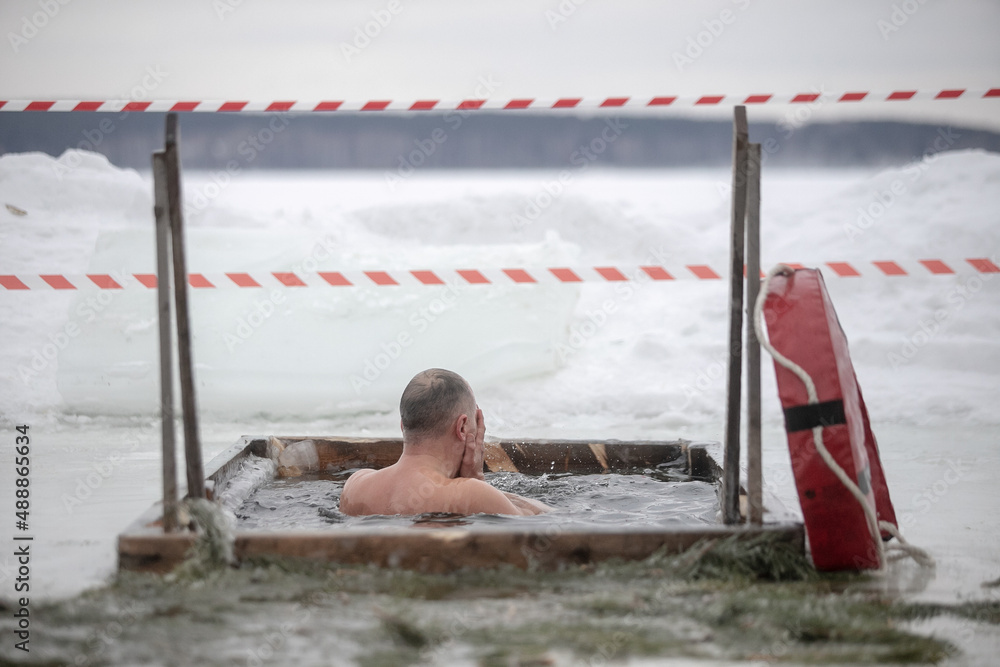 Baptism, bathing in the winter ice hole, beautiful winter landscape ...