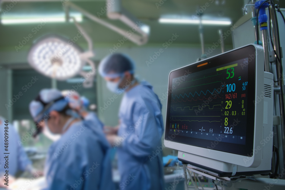 Heart rate and patient control monitor in hospital theater room during ...