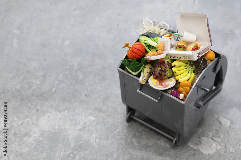 Garbage trash can, Image of food waste made in miniature. The letters ...