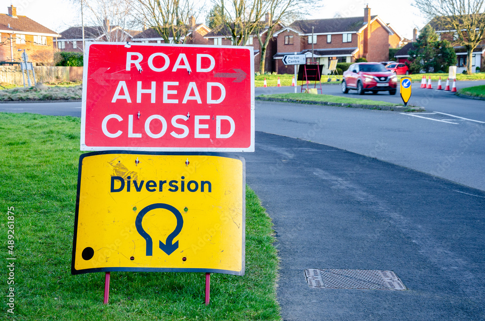 Road signs warning motorists of diverted traffic and road closures due ...