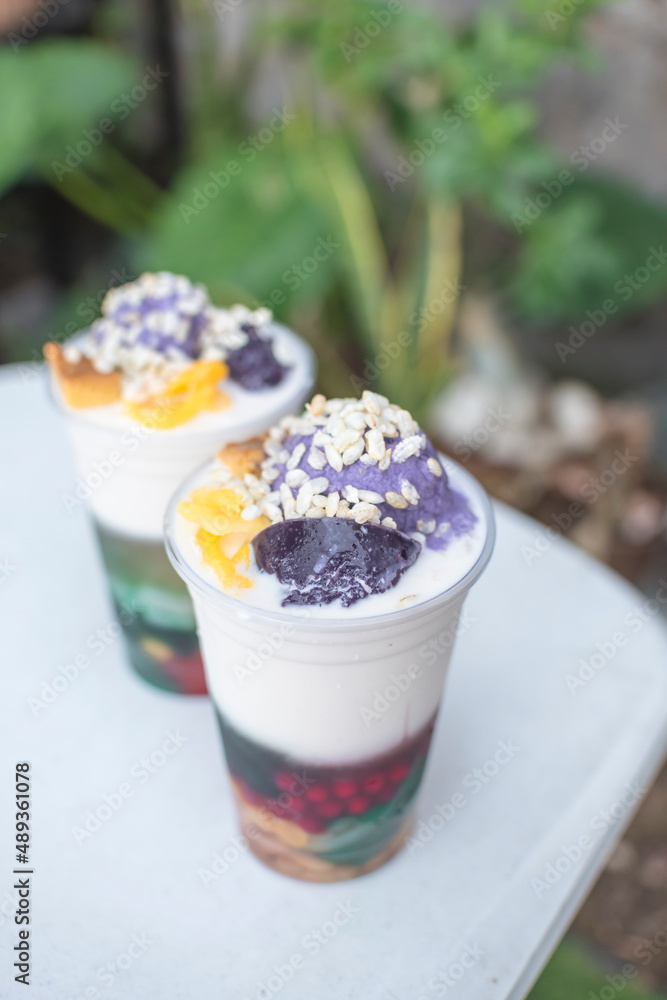 Two plastic cups of Halo-halo, a popular cold dessert in the ...