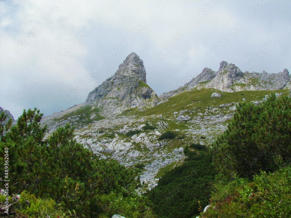 Scenic view of pointy mountain peak above a mountain hut at Zavetišče ...