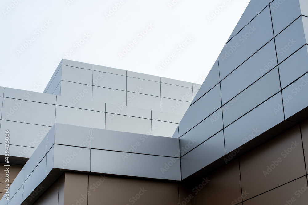 The exterior wall of a contemporary commercial style building with ...