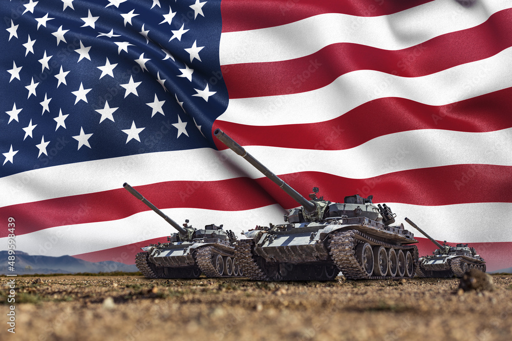 Tanks lined up in front of an American or USA flag. Several military ...