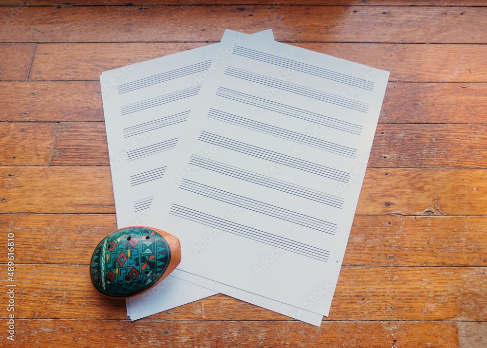 White Lined Music Staff Paper with Green Design on Peruvian Flute on ...