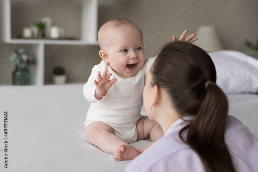 Happy excited baby laughing at mom face, showing positive emotions ...