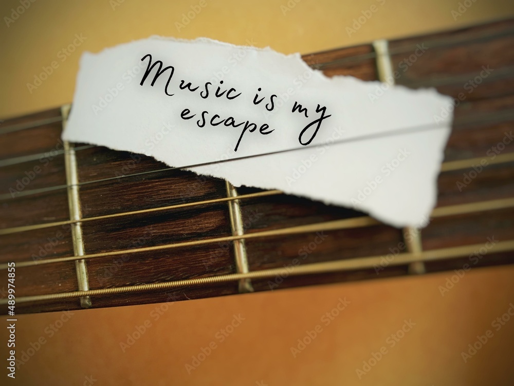 Simple text message on a small piece of ripped paper - music is my ...