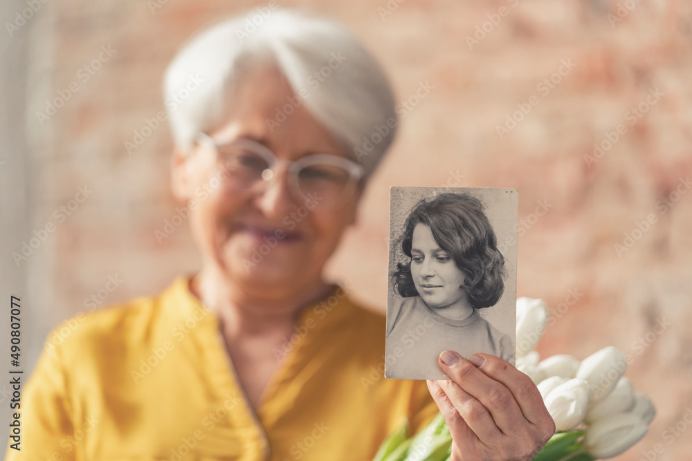 retired elderly senior caucasian woman camera focus on the black and ...