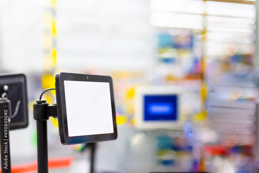 Monitor - white screen mockup hanging in a supermarket at the checkout ...