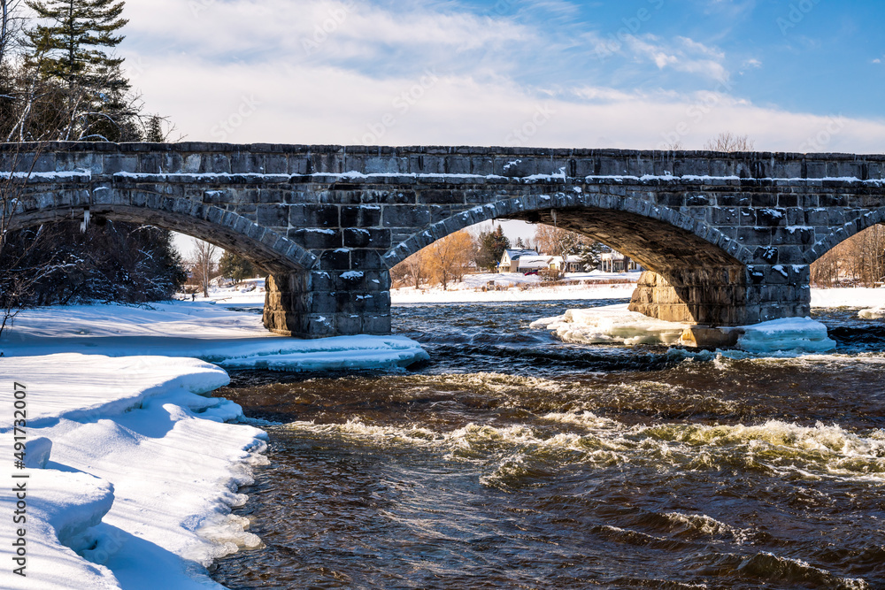 The five stone arch bridge over the Mississippi River in the village ...