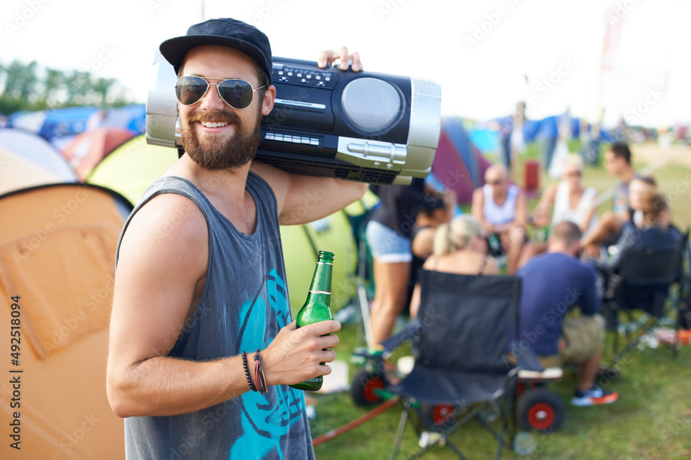 Rocking out with my boombox. Shot of a guy carrying a boom-box on his ...