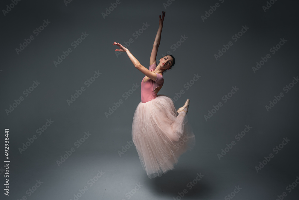 Ballerina dancing in motion in the air. Young pretty, fragile ...