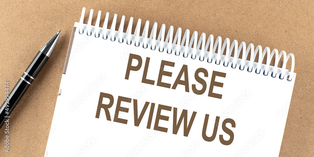 PLEASE REVIEW US text on a notepad with pen, business Stock Photo ...