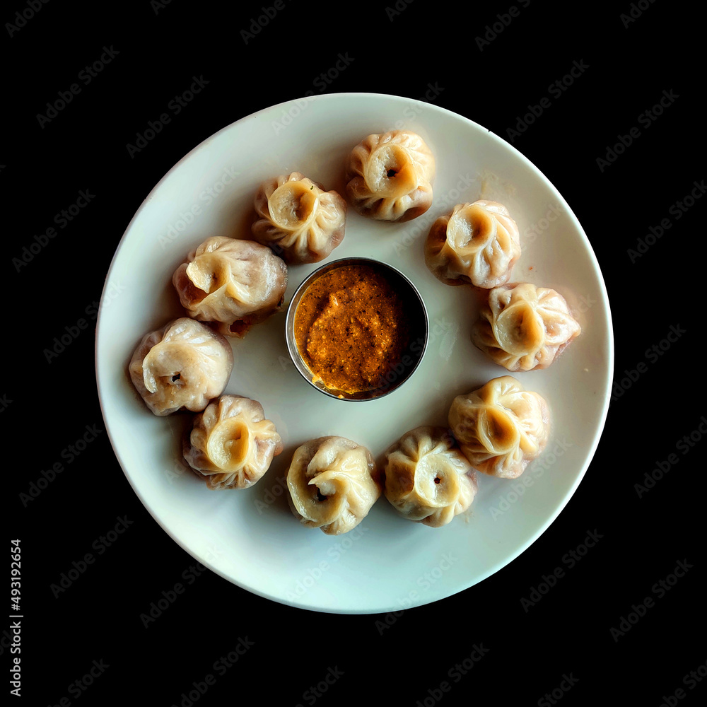 Steam-cooked momos with sauce, Nepalese Traditional Dish Momo. Steam ...
