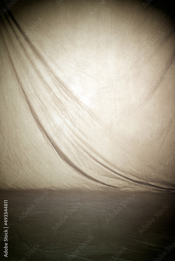 Neutral color cloth drape fabric background or backdrop with center ...