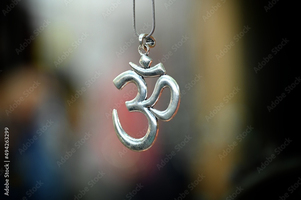 The AUM symbol symbolizes the Universe and the ultimate reality. It is ...