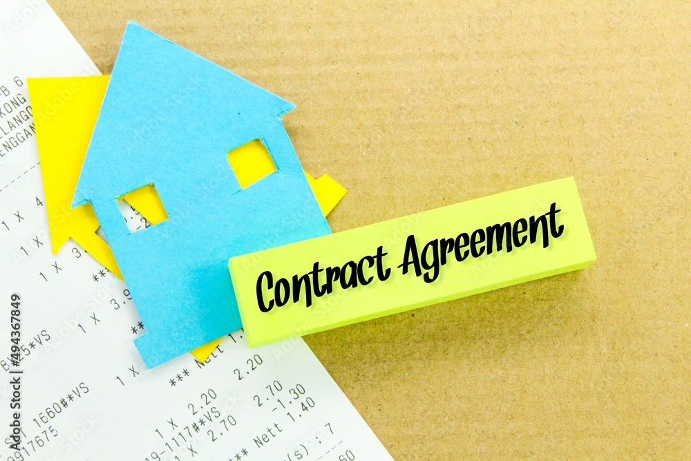 receipts, paper houses and colored paper with the words contract ...