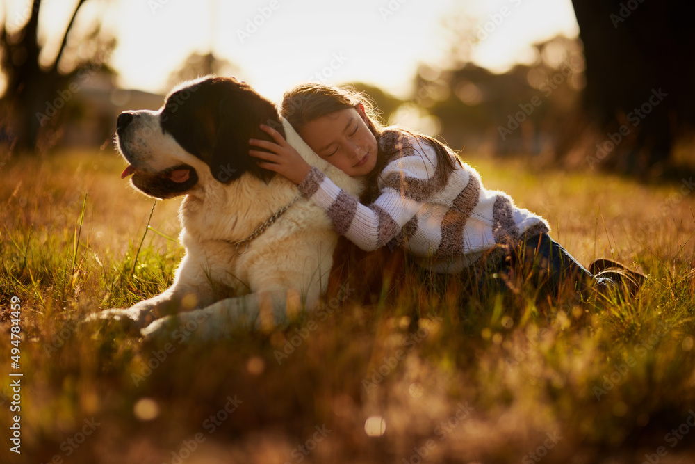 Friends come in all shapes and sizes. Shot of a cute little girl ...