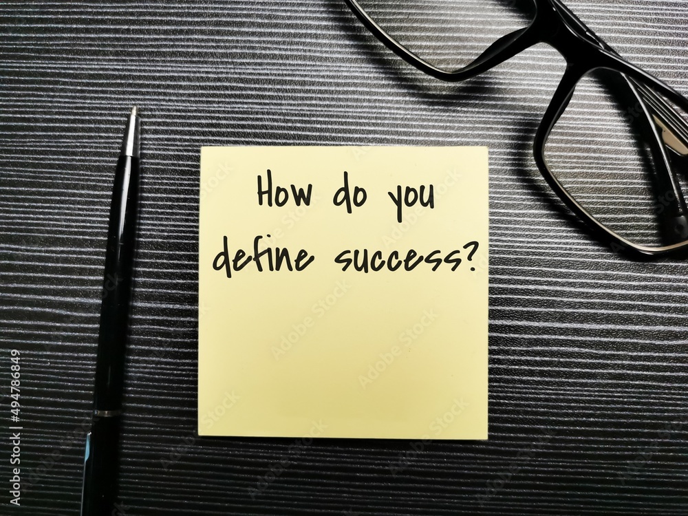 Top view image of sticky note written how do you define success with a ...