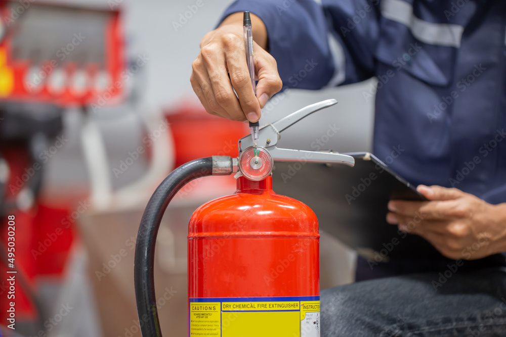 Engineer are checking and inspection a fire extinguishers tank in the ...