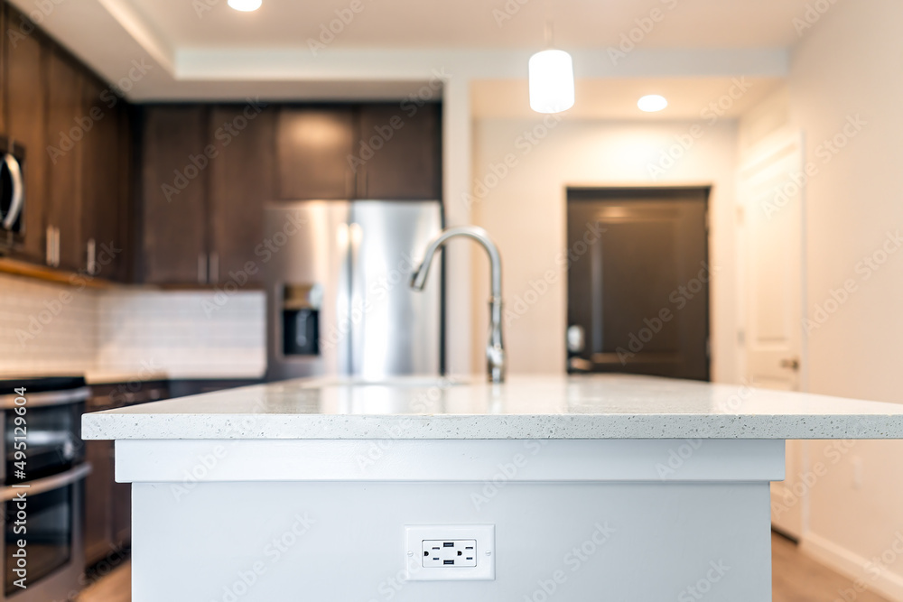 Kitchen room quartz countertop surface with electrical outlet on island ...