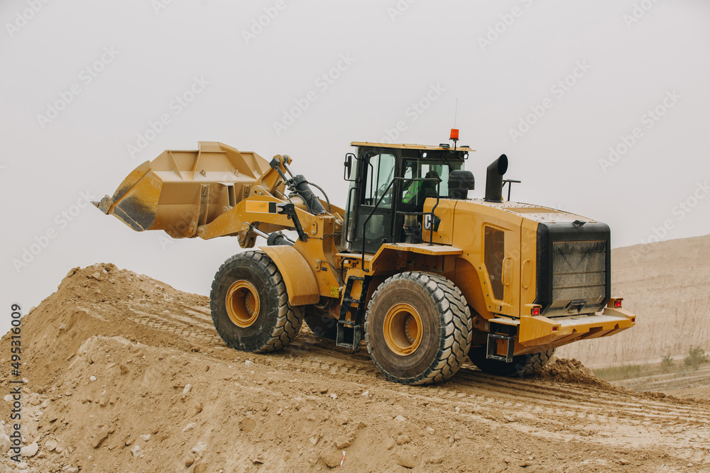 Dozer, excavator, and road rollers working on the mud site Stock Photo ...