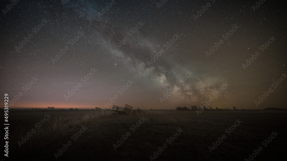 Transition inte dawn, Milky way and cart Stock Photo | Adobe Stock