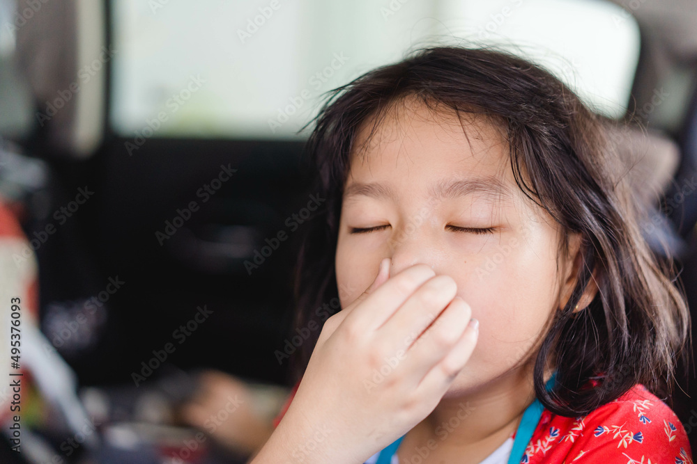 Asian kid girl covers her nose because of her sibling farting make a ...