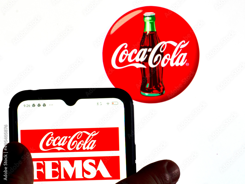 In this photo illustration, the Femsa drink logo is displayed on a ...