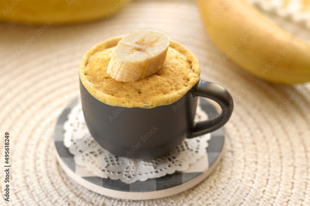 selective focus. cupcake in a mug with banana pieces. Banana cupcake on ...