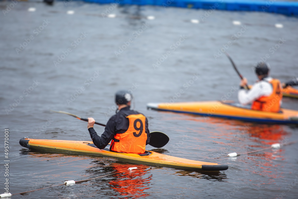 Canoe polo match, two teams play kayak polo game outdoor competition in ...