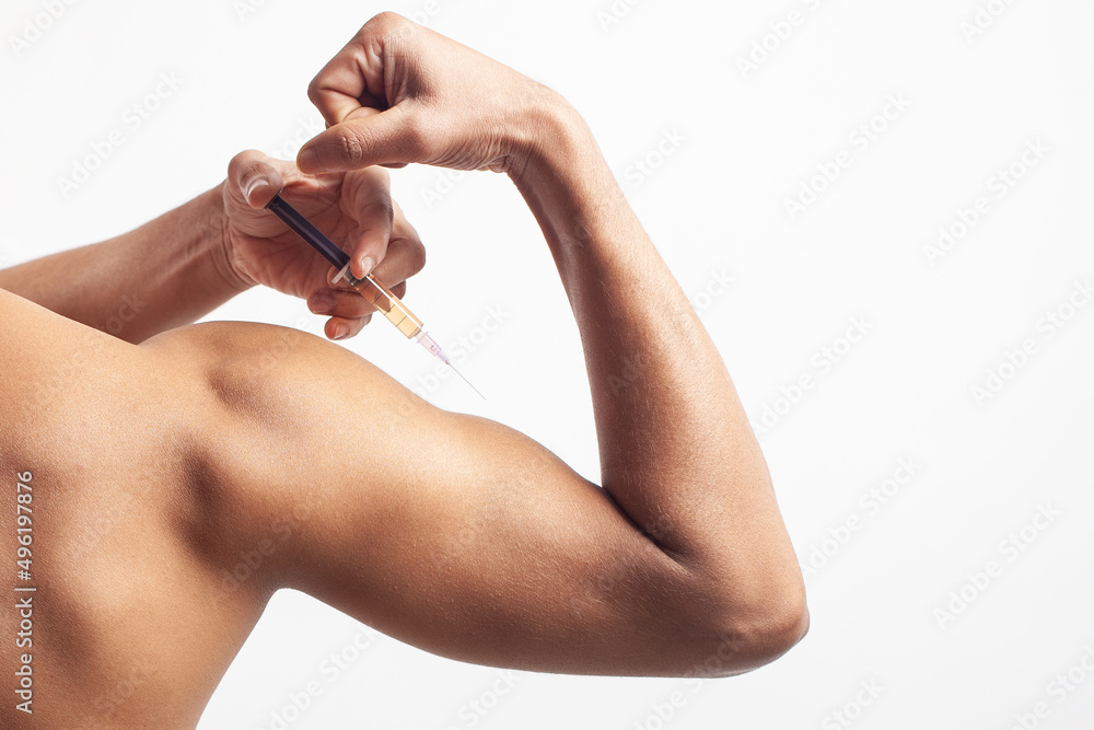 slim athlete guy injecting anabolic steroid on his arm closeup view ...
