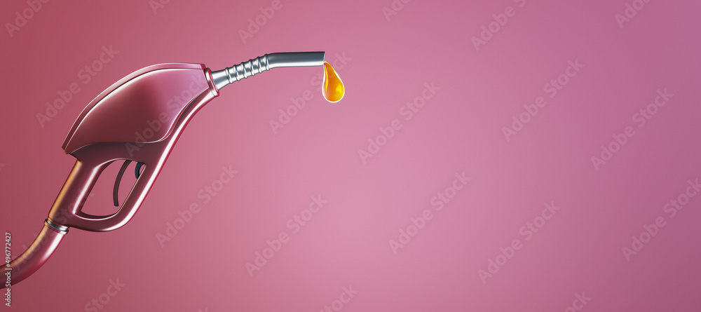 Fuel pistol pump nozzle with petrol drop on wide pink background with ...