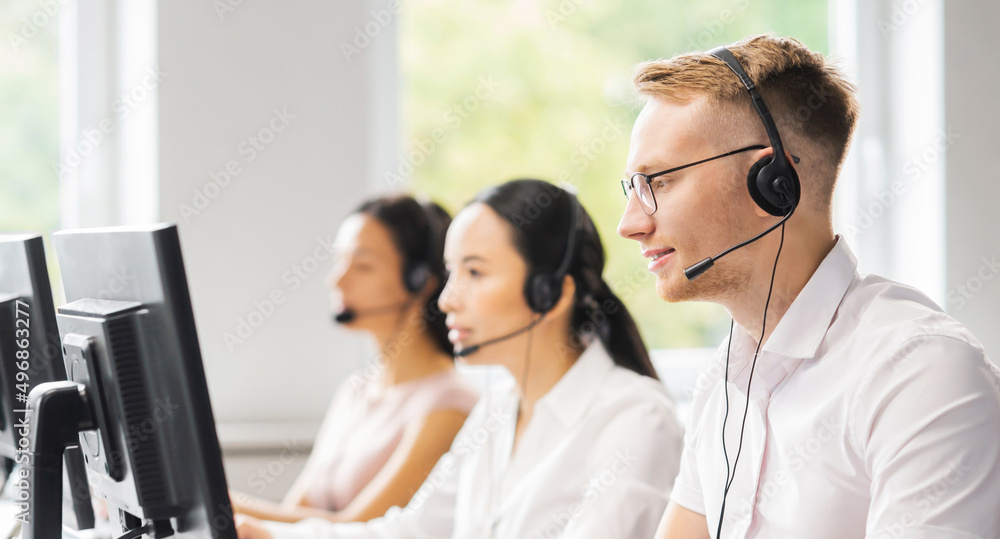 Team of professional support staff working in the office. Colleagues in ...