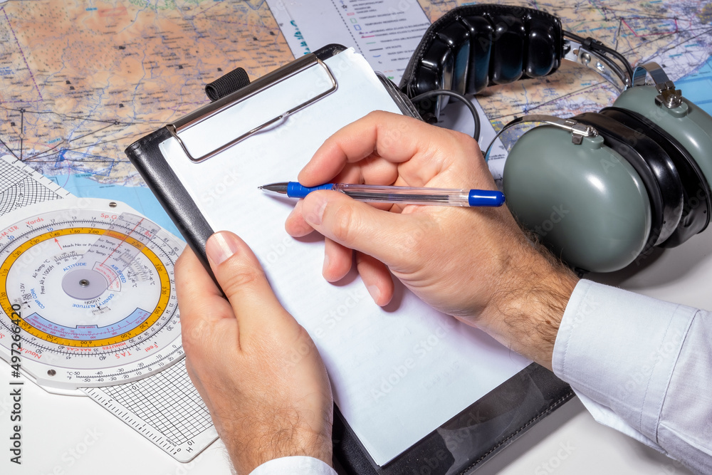 The pilot is preparing to fly. Route calculation, flight plan ...