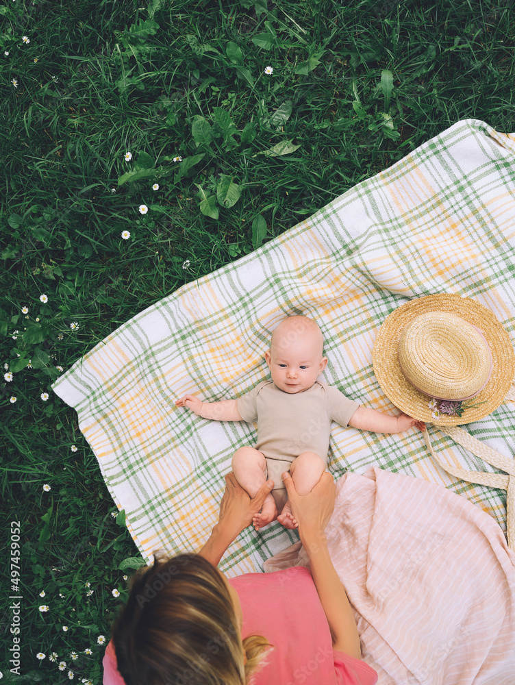 Beautiful mother and baby on nature. Young woman with her baby in ...